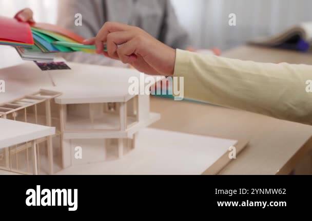 Slow motion home designer using architectural equipment draw a ...
