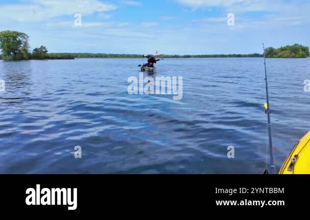 Kayaking on fishing pedal kayak at the lake during summer adventure ...