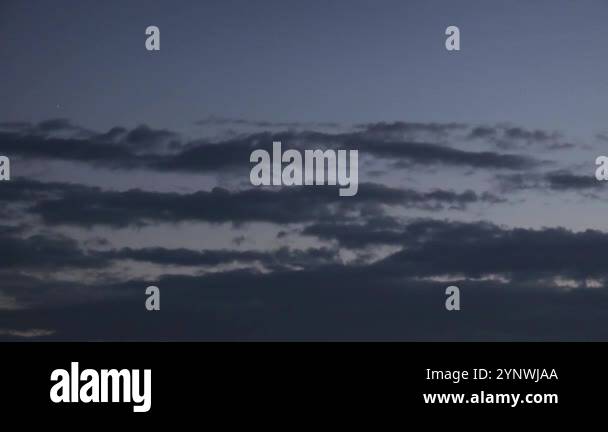 Witness the breathtaking transformation of the sky during twilight as ...