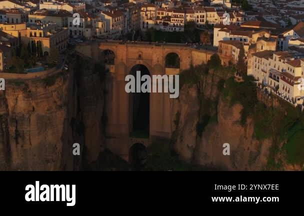 Ronda's Puente Nuevo bridge spans a deep gorge, connecting city parts ...