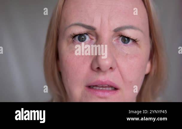 woman eyes anxiety with pain eyes, looking at camera, feeling ...