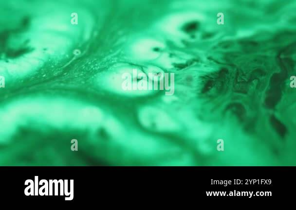 Ink drip. Liquid spill. Defocused cyan green color glowing acrylic ...