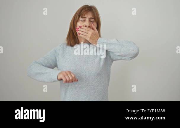Tired middle age woman yawning displeased with boredom, standing, hand ...