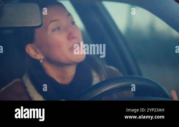 Woman drives her car, expressing whole range of emotions from happiness ...