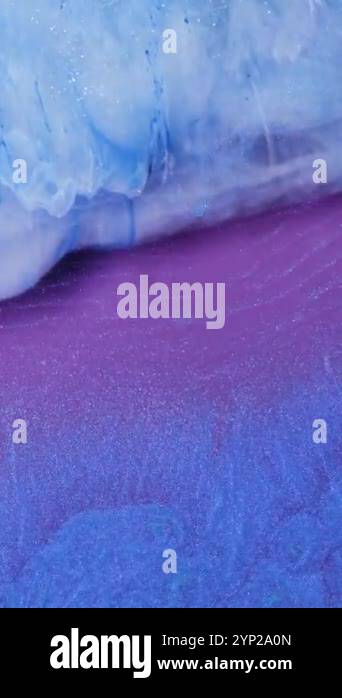 Watch as vibrant blue and purple alcohol inks flow and blend on canvas ...