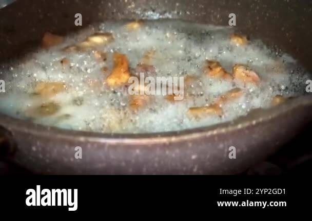 Fried pork belly in hot oil pan,homemade cooking at home style ...