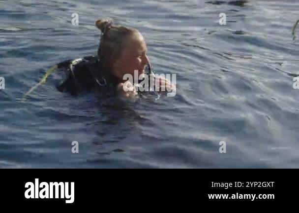 A Woman In Scuba Diving Gear With Her Hair Pulled Back And Wearing A 5376