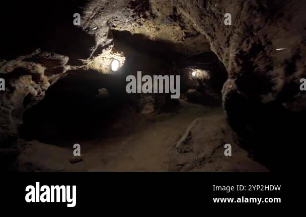 An underground cave in a mountain massif. Exploring the underworld ...