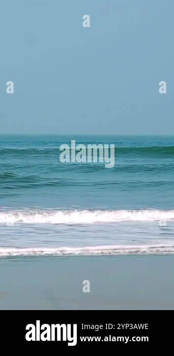 A serene and picturesque view of gentle ocean waves gently lapping ...