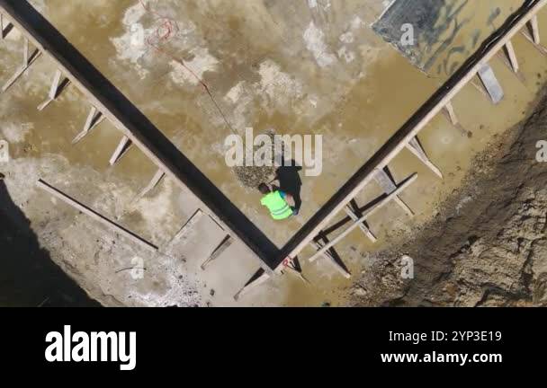 Watch the construction crew study blueprints, bend rebar, and insulate ...