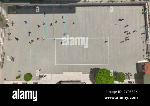 Watch from above as children enjoy playtime, filling the school ...