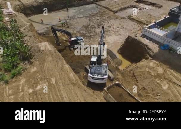 Witness a strong start to construction with excavation and foundation pouring for a high-rise ...
