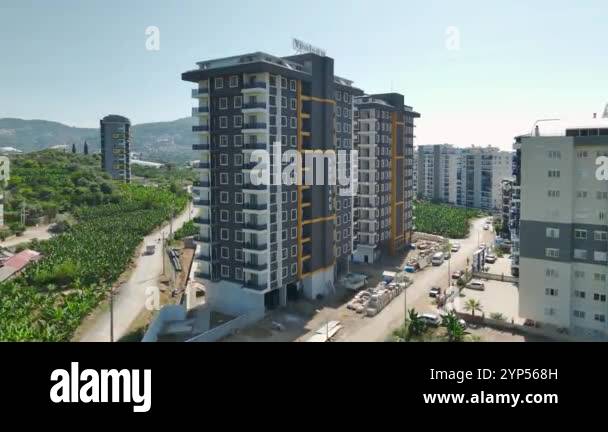 Follow oceanfront home building as facades, pools, and common grounds ...