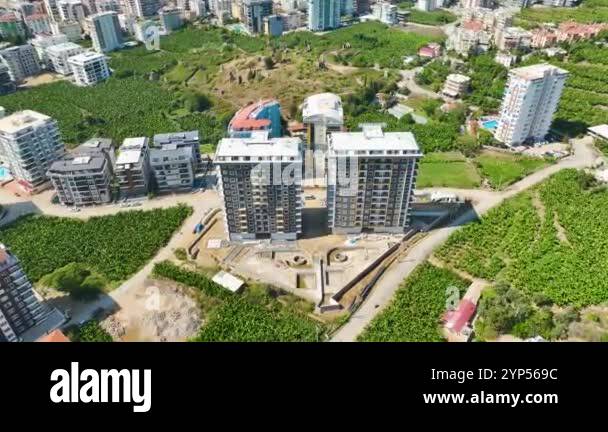 Experience coastal home construction as facades, pools, and complex ...