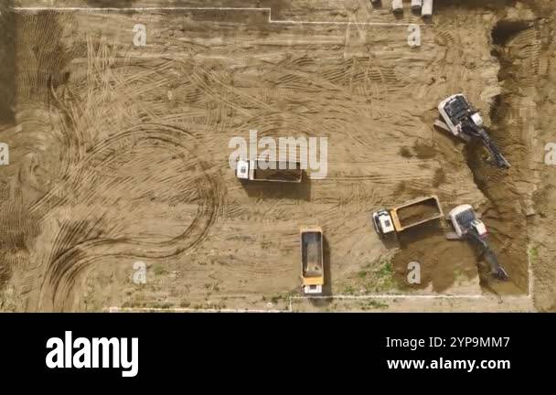 Watch the site preparation work as an excavator and trucks dig at an ...