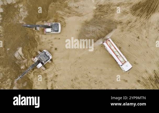 Fly over a construction site during the early building efforts, with ...