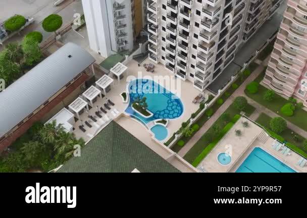 Experience the opulence of a pool in an exclusive residential complex, filmed from above in 4K ...