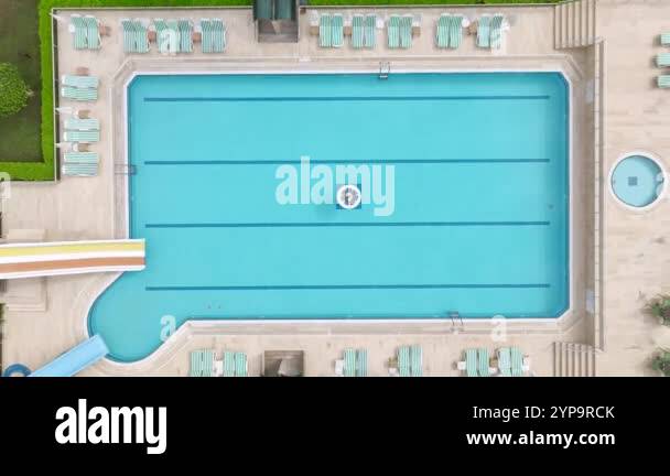 Watch the high-end pool area in an exclusive complex, showcasing luxury ...