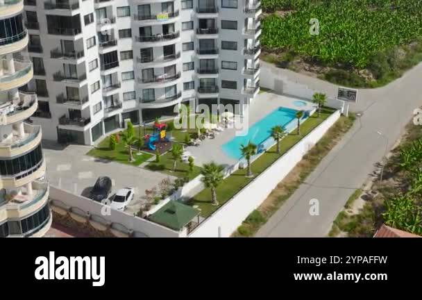 Marvel at the foundations of the future, with homes rising in a small coastal town, each phase ...