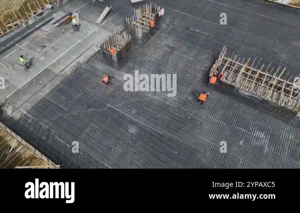 See the construction team bending rebar and prepping the structural ...