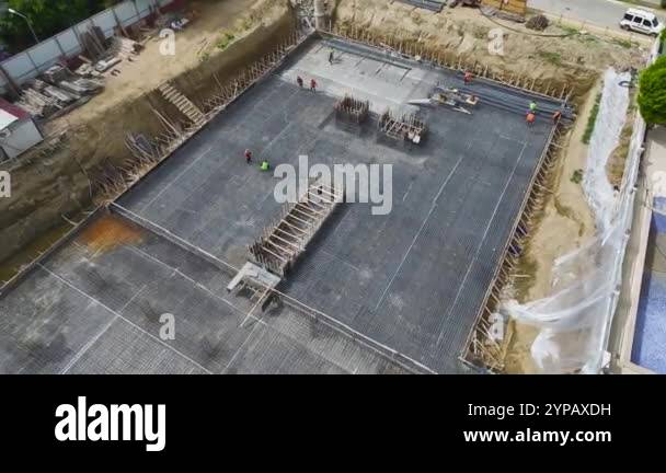 Watch workers bending rebar and laying the foundation for a new ...