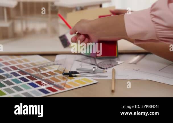 Slow motion interior designer using architectural equipment draw a ...