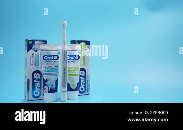 A blue and white box of Oral B toothpaste and a toothbrush. The image ...