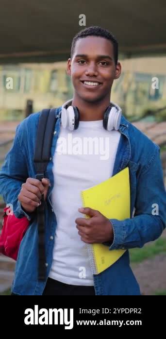 Vertical. Ambitious and Friendly African American Male Student Standing ...