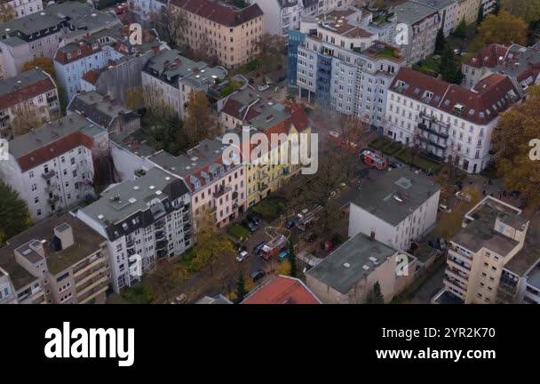 Firefighters working to extinguish a fire in a residential building in ...