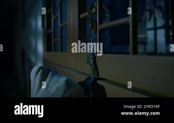 Low-key closeup of hands of unrecognizable criminal or kidnapper ...