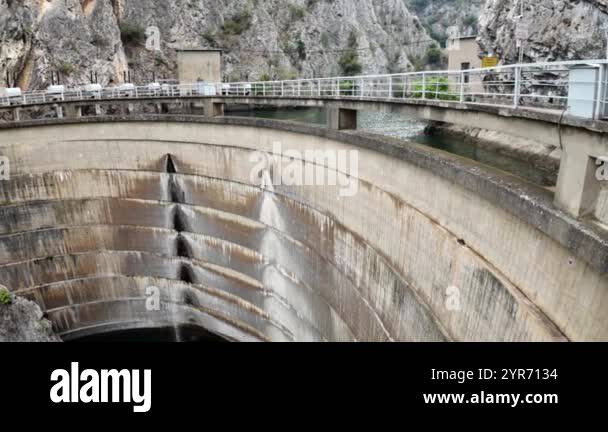 Water trickles down the curved face of the Matka dam, a concrete marvel ...