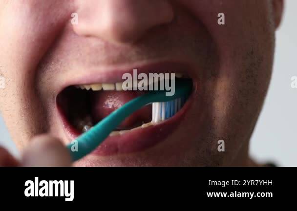 Man brushing his teeth with toothbrush. Fighting tooth decay Stock ...