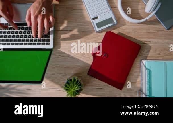 Entrepreneur hands writing email at green screen laptop at organized ...