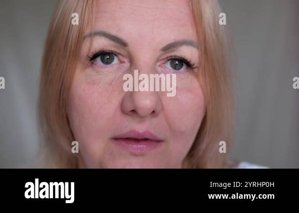 sad woman face Upper face close up shot of sad elderly mature lady with ...
