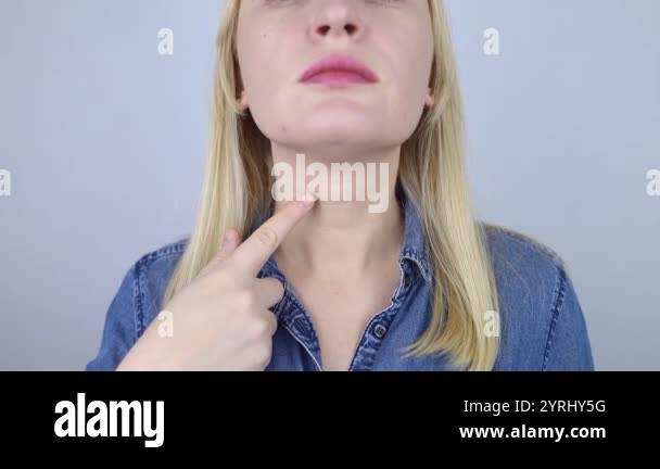 Thyroid Disease Woman Points To Her Neck Where The Thyroid Gland Is