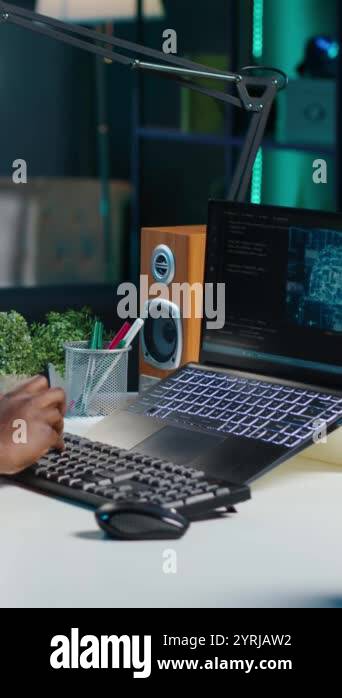 Vertical Video Ai Expert Writes Code On Laptop In Apartment Office Using Java Programming