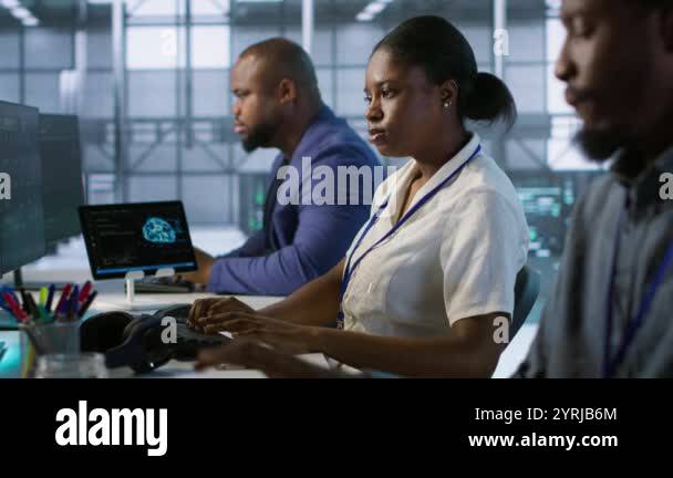 Woman putting headphones on in server room, developing disaster ...
