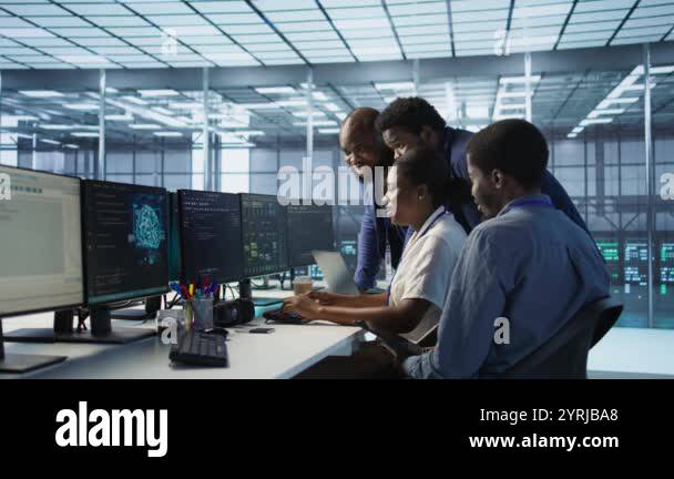 Data center coworkers laughing, having fun while maintaining company ...