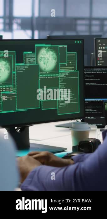 Vertical video Surprised data center technician celebrating after successfully managing to ...