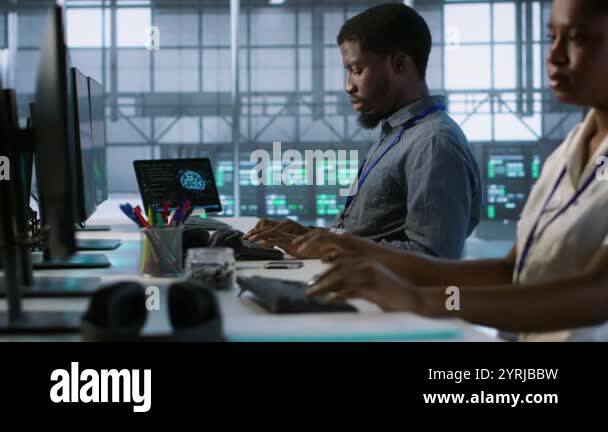 Data center engineers maintaining company network infrastructure by installing, configuring ...