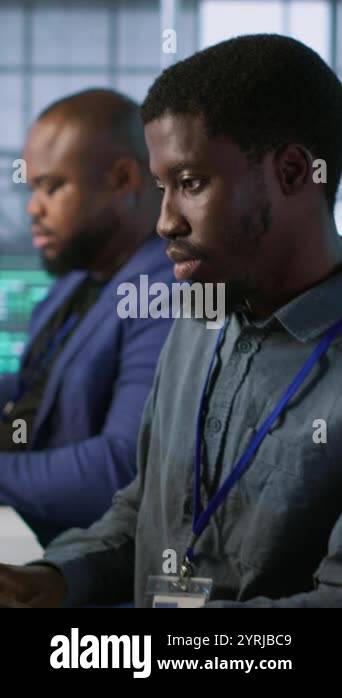 Vertical Video Team Of Engineers In Data Center Developing And