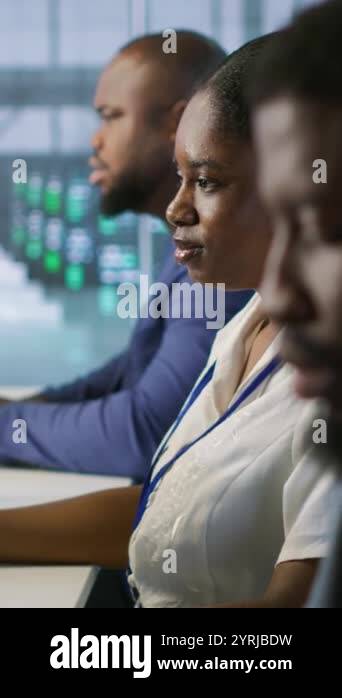 Vertical video Software developers in data center implementing AI predictive maintenance systems ...