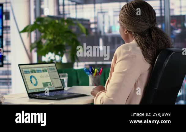 Empowered black CEO working in high end downtown corporate office ...