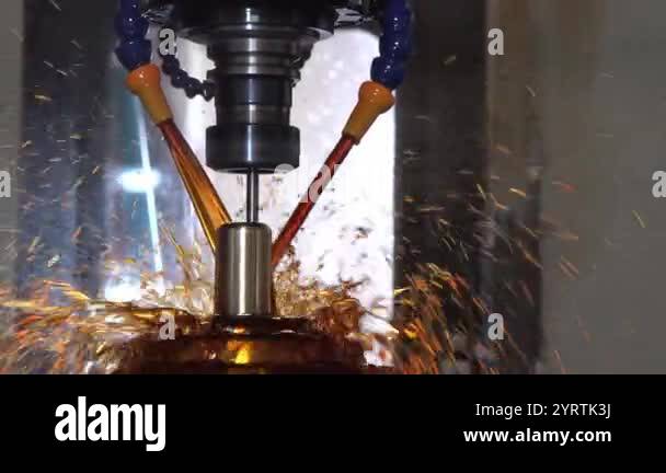 Pan scene the CNC milling machine cutting the shell mold parts with oil ...