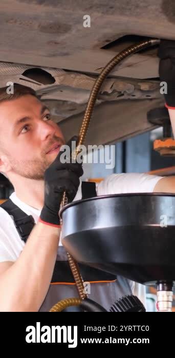 In this video, a mechanic shows essential car maintenance techniques ...