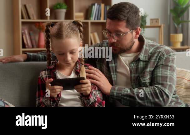 Worried upset Caucasian dad man male daddy touching speak little girl ...