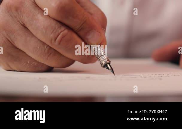 Close up man hand male holding fountain pen write writing paper ...
