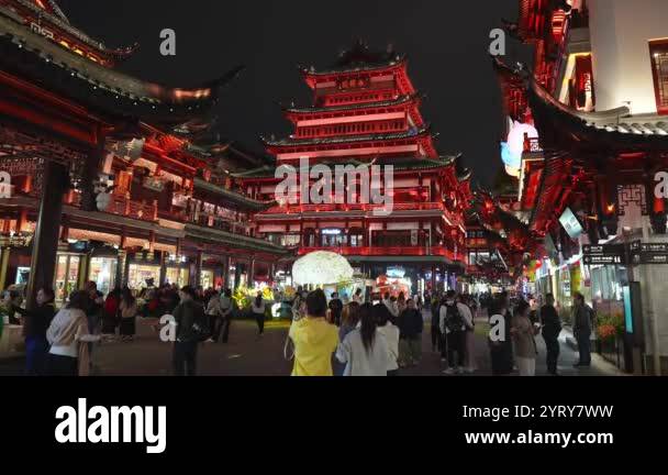 Yu Gardens in Shanghai at night, featuring traditional architecture lit ...