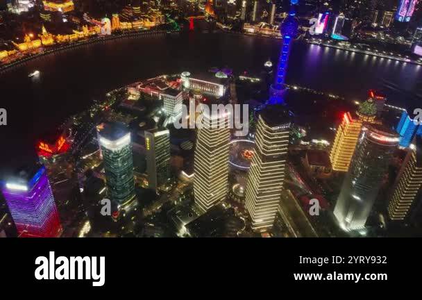 Shanghai's vibrant cityscape at night with the Bund, Shanghai Tower ...