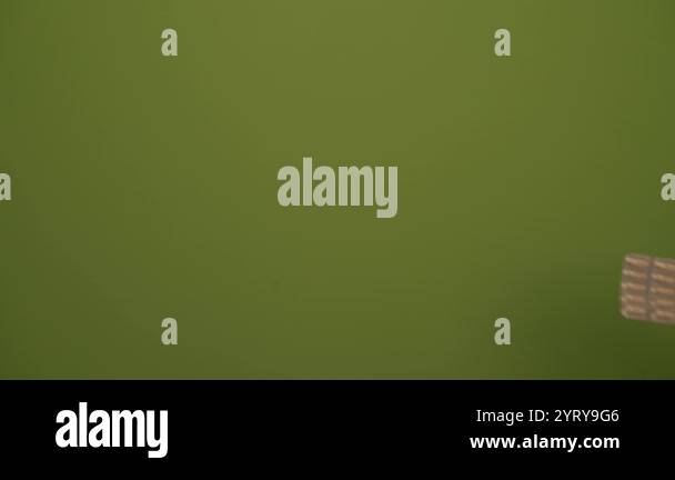 This vibrant green wall serves as an ideal backdrop for various ...